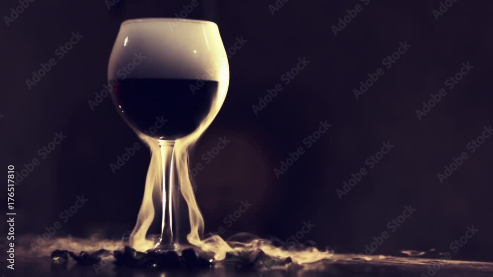 Red wine in glass with dry ice Stock Video | Adobe Stock