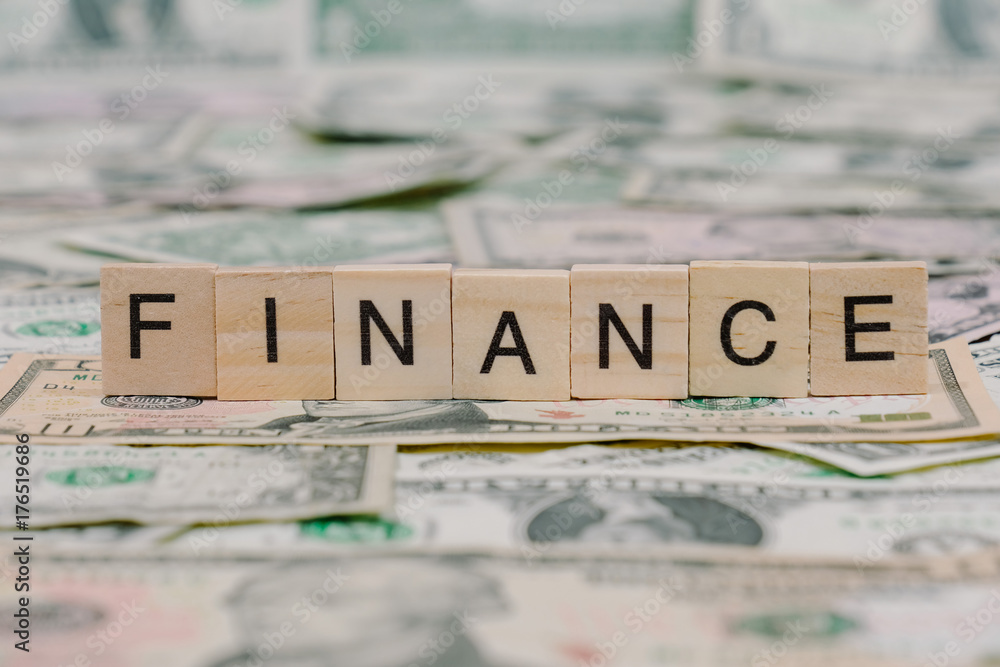 the word "FINANCE" written in wooden block letters Stock Photo | Adobe ...