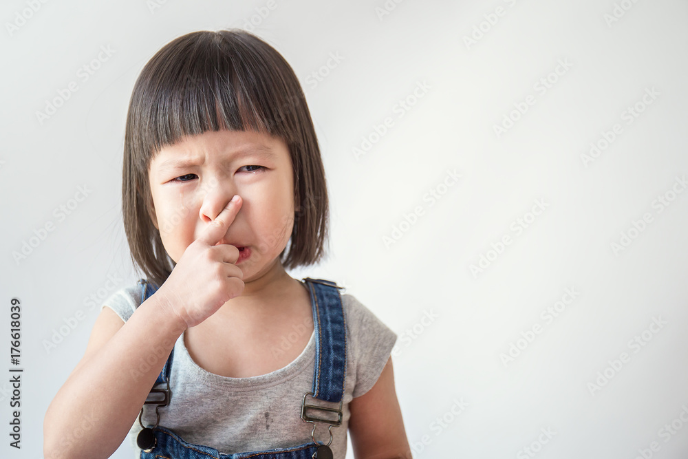 Closeup portrait of little asian crying girl with little rolling tears ...