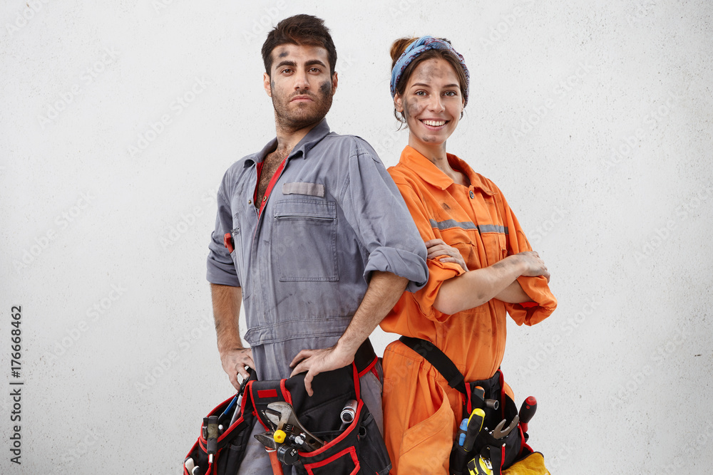 Two service workers being glad, feel proud to remove breakage, look ...