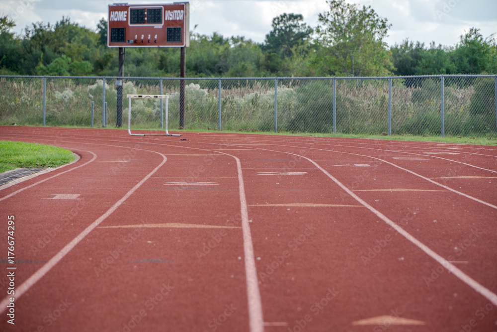 Track and field red clay at a high school stadium Stock Photo | Adobe Stock