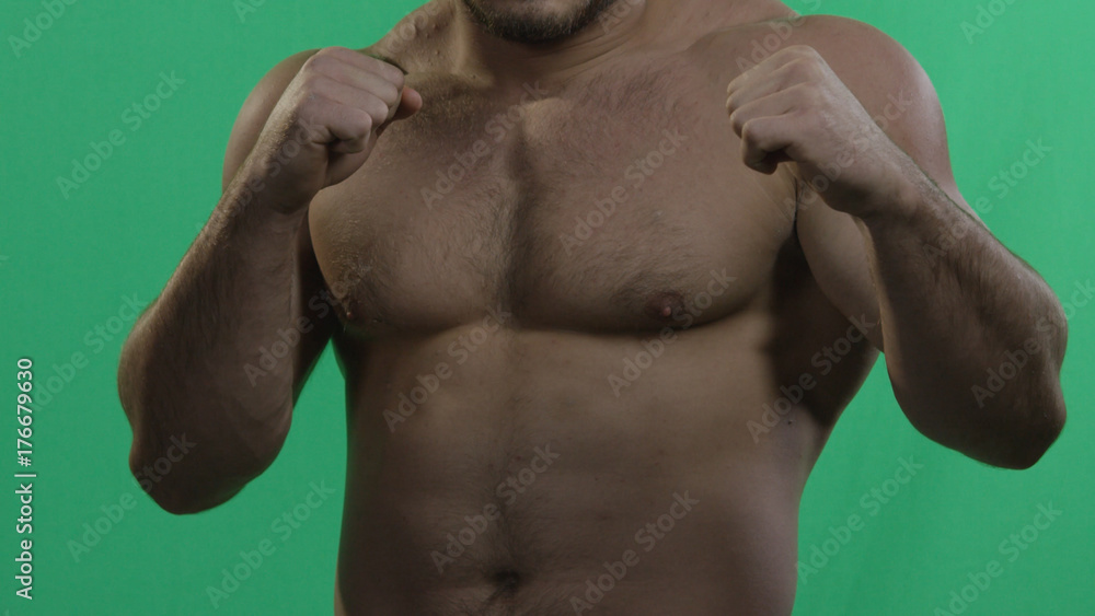 MMA fighter on a green screen. Muscular man on green screen. Green ...
