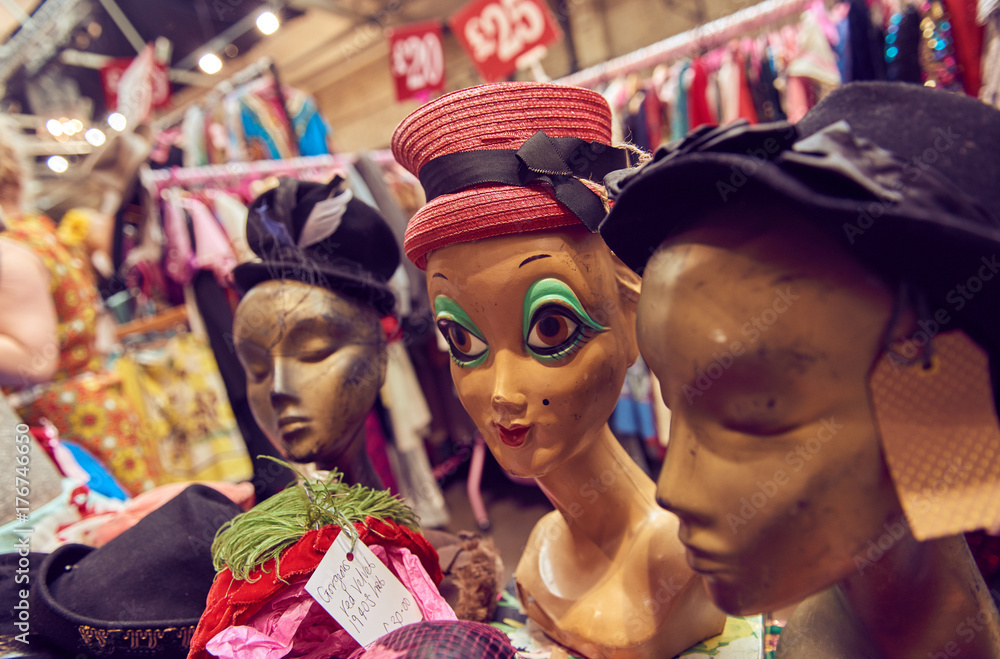 Vintage second hand hats on unusual retro ugly head mannequins, and a ...