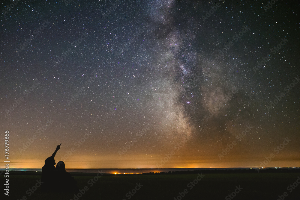 couple in love under stars of center our home galaxy Milky Way. Two ...
