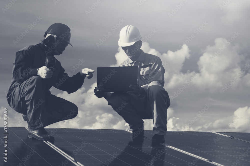 operation and maintenance in solar power plant ; engineer working on ...