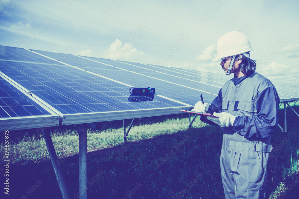 operation and maintenance in solar power plant ; engineer working on ...