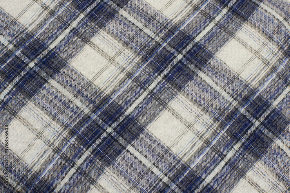 ..tekstura tkani v kletku, fon iz kvadratov sinego tsveta na tkani ...
