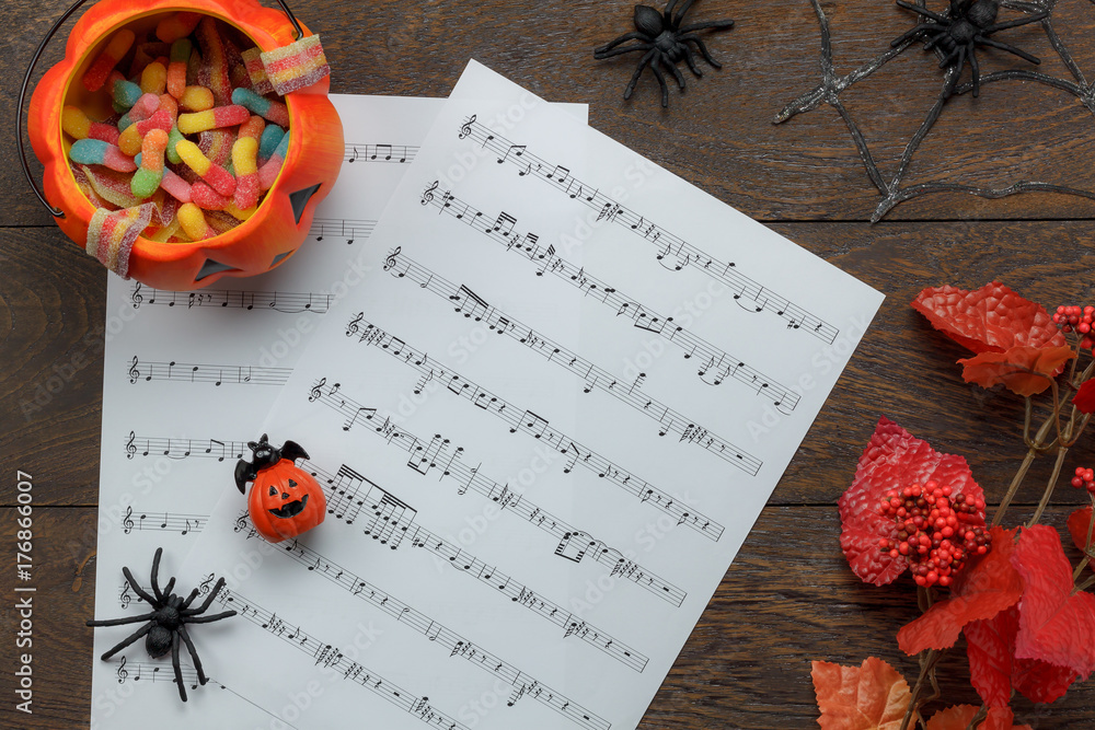 Top view of Happy Halloween Festival and music note sheet background ...