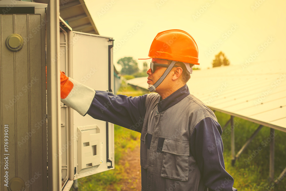 operation and maintenance in solar power plant ; engineer working on ...
