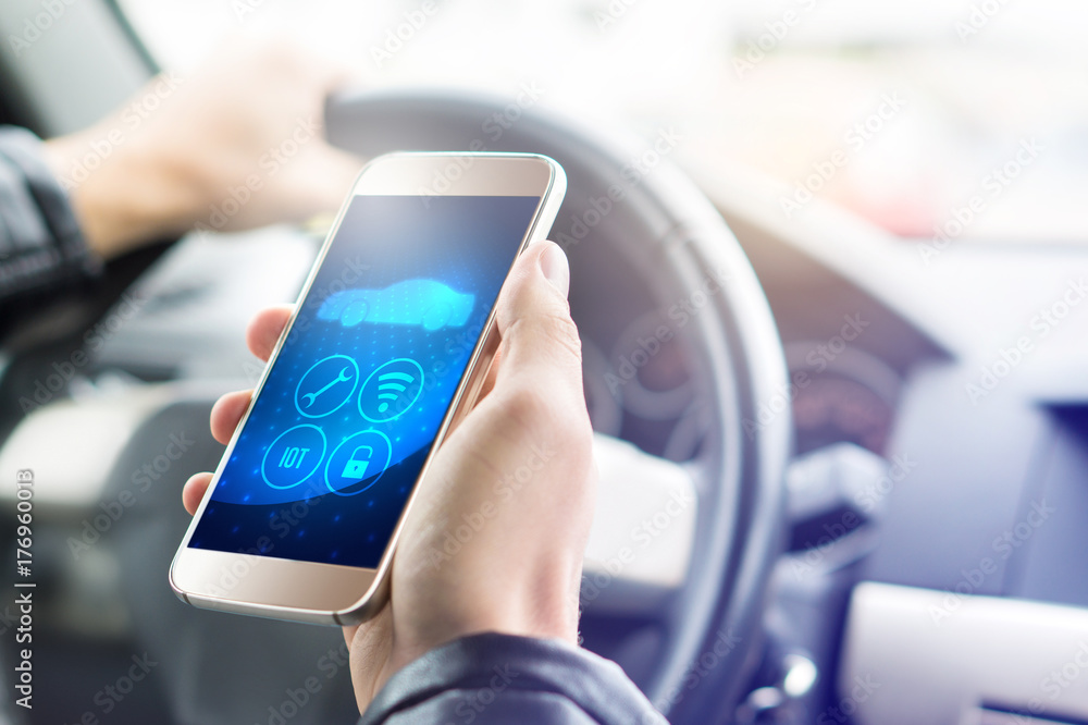 Internet of things (IOT) mobile app in smart phone for modern car. Hand ...