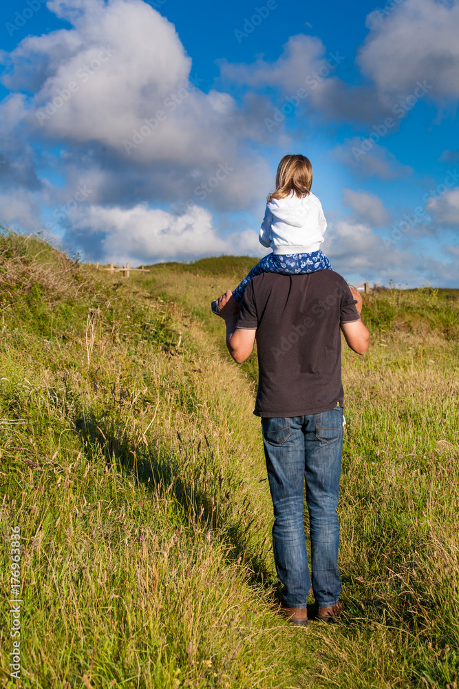 Father and daughter. Daddy carrying little girl. Dad giving female ...