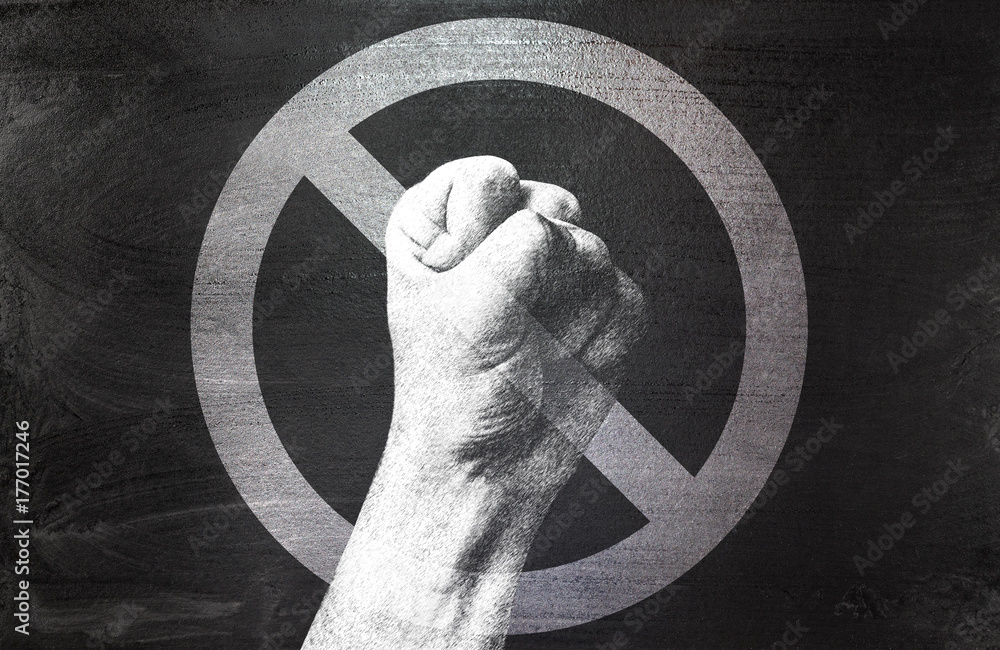 No violence. Stop bullying. Fist drawn on a chalkboard and blackboard ...
