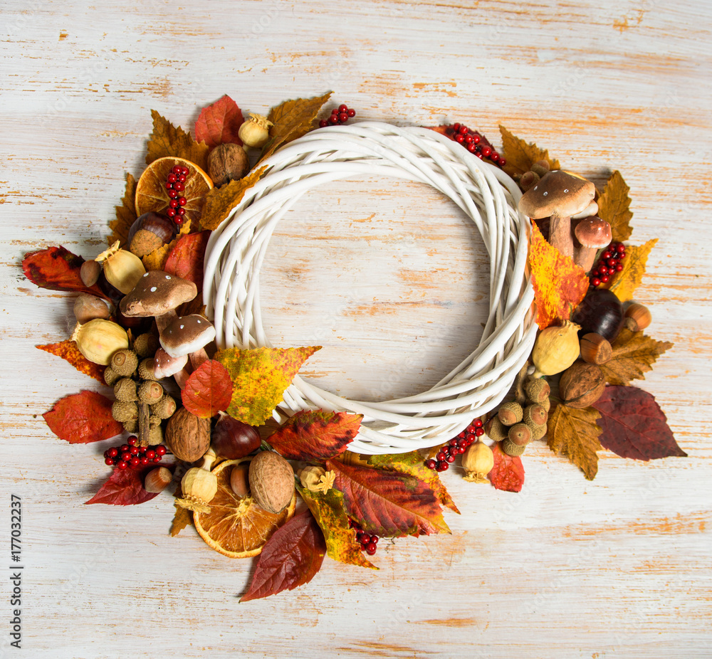 Autumn Wreath made of autumn leaves, chestnuts, nuts, peanuts, acorn ...