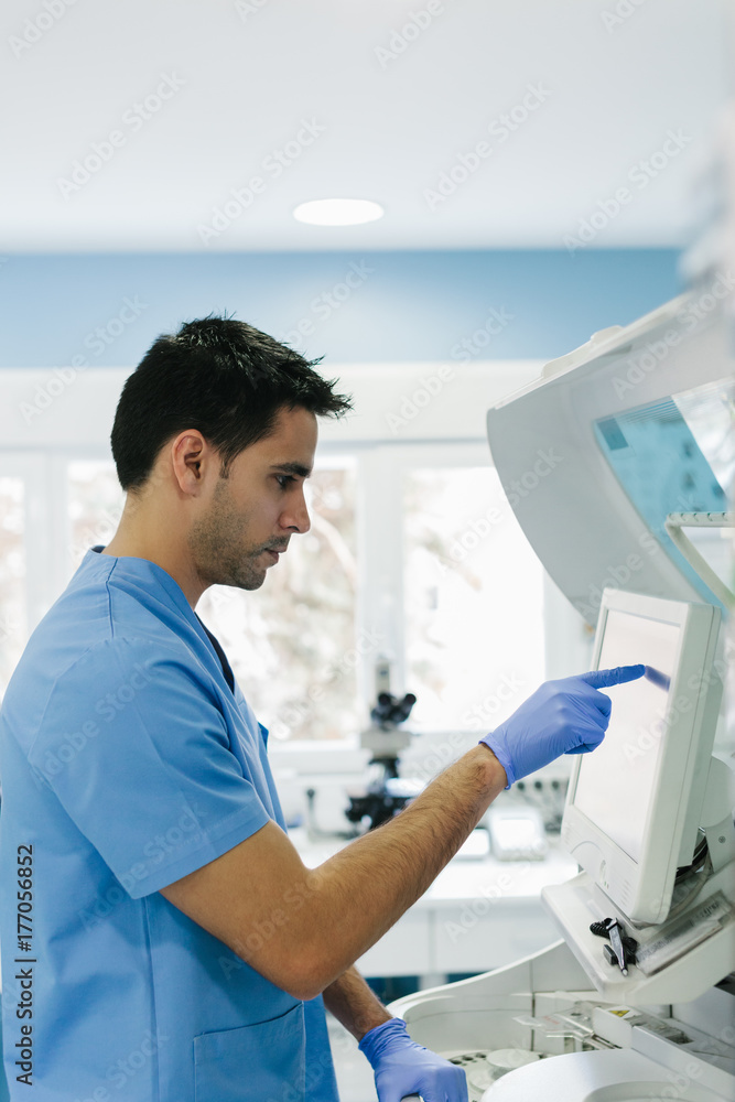 Biologist Using a Touch Screen in a Laboratory Stock Photo | Adobe Stock