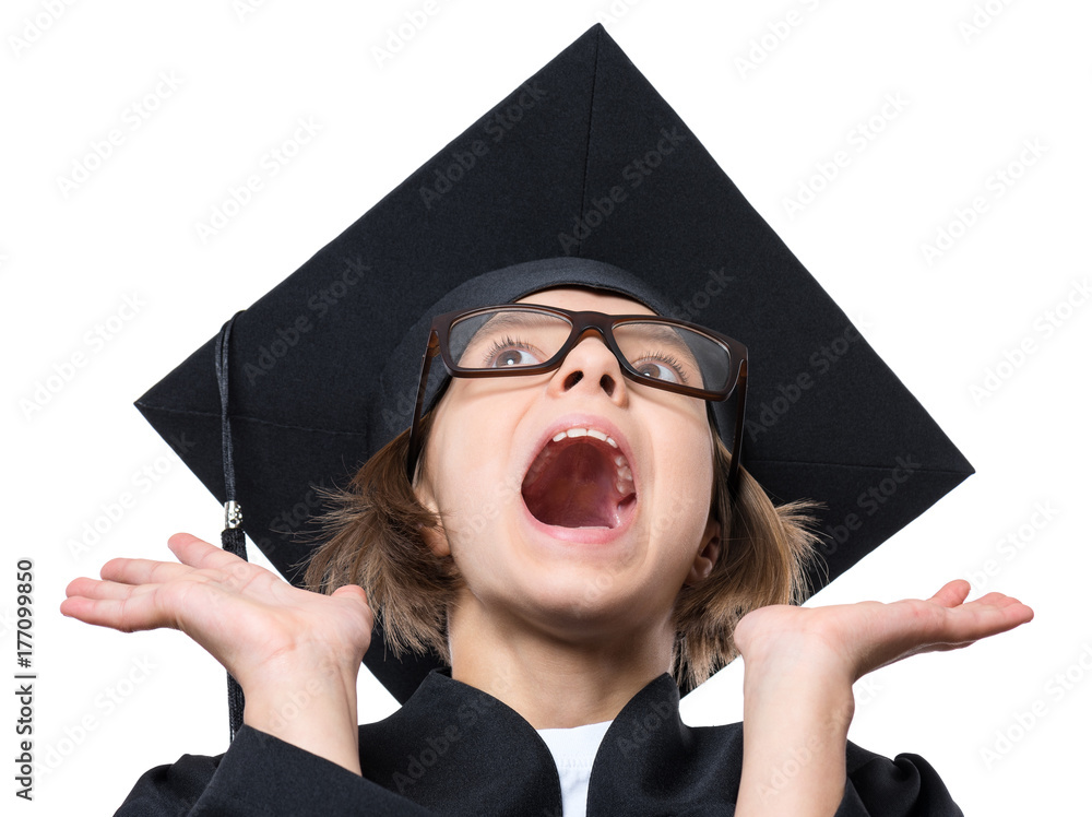 Portrait of surprised graduate little girl student in black graduation ...