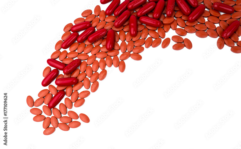 Red vitamins and supplements capsule and iron tablets isolated on white ...