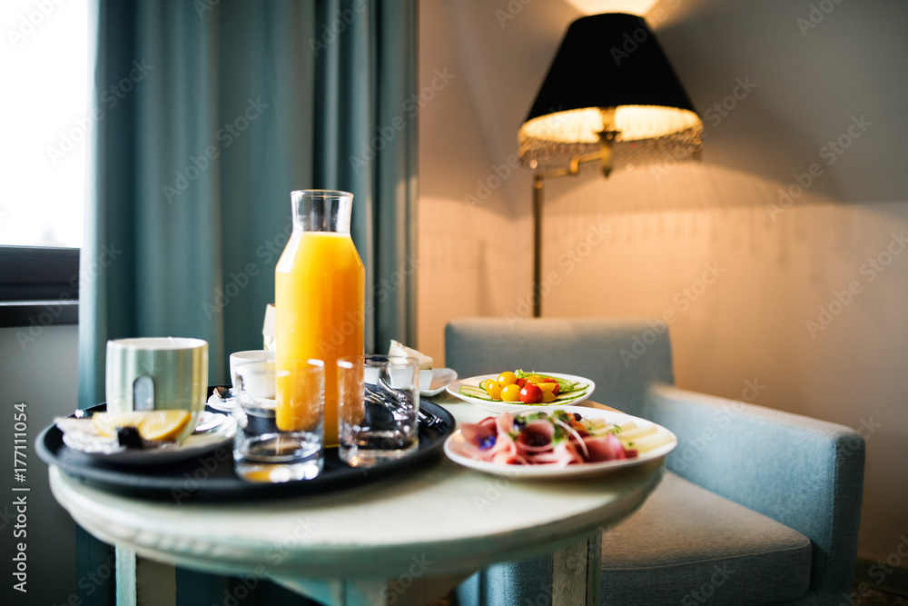 Food on a table in a hotel room. Stock Photo | Adobe Stock