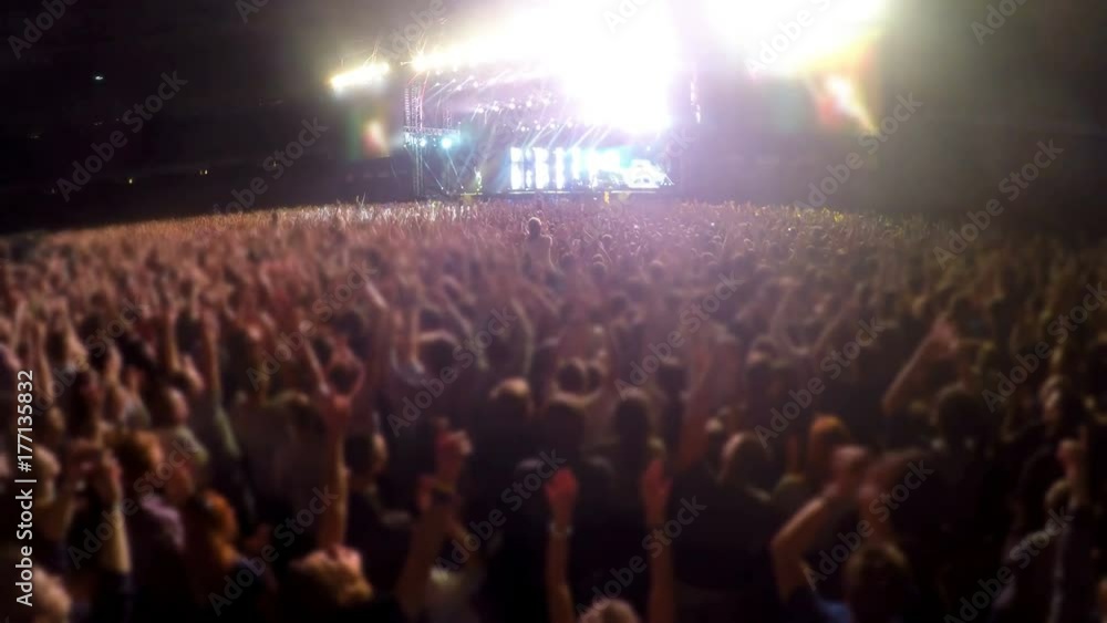 Crowd of people putting hands in air and clapping, fans at concert ...