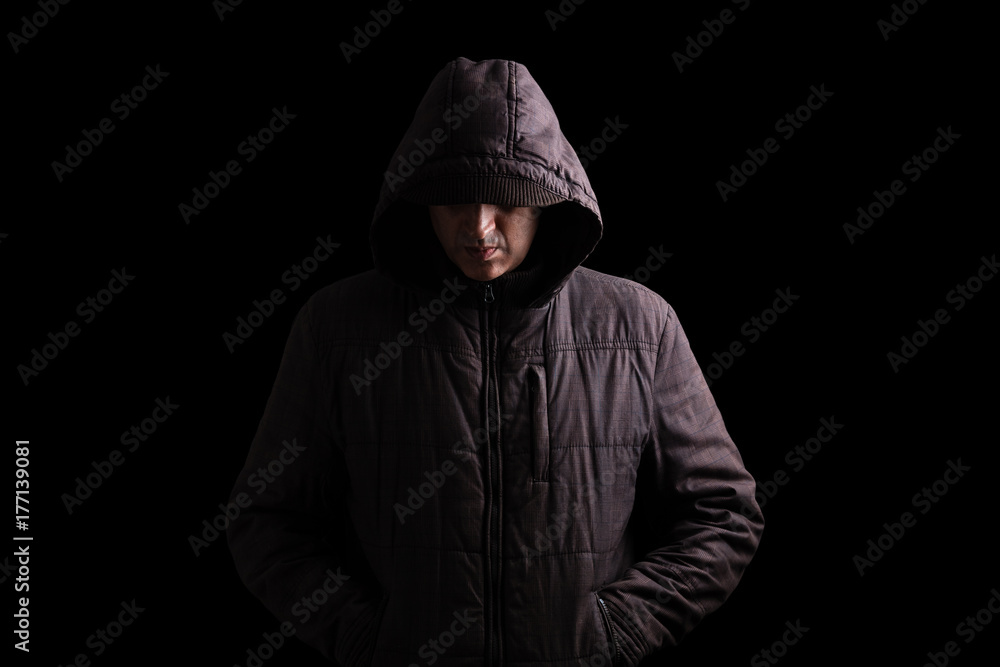 Scary and creepy man hiding in the shadows, with the face and identity ...