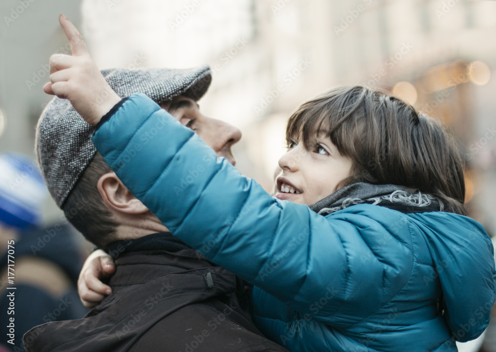Boy indicating something to his father with his index finger Stock ...