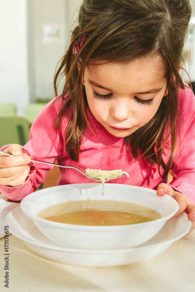 Beautiful Little Girl Eating Soup at the School Canteen Stock Photo ...