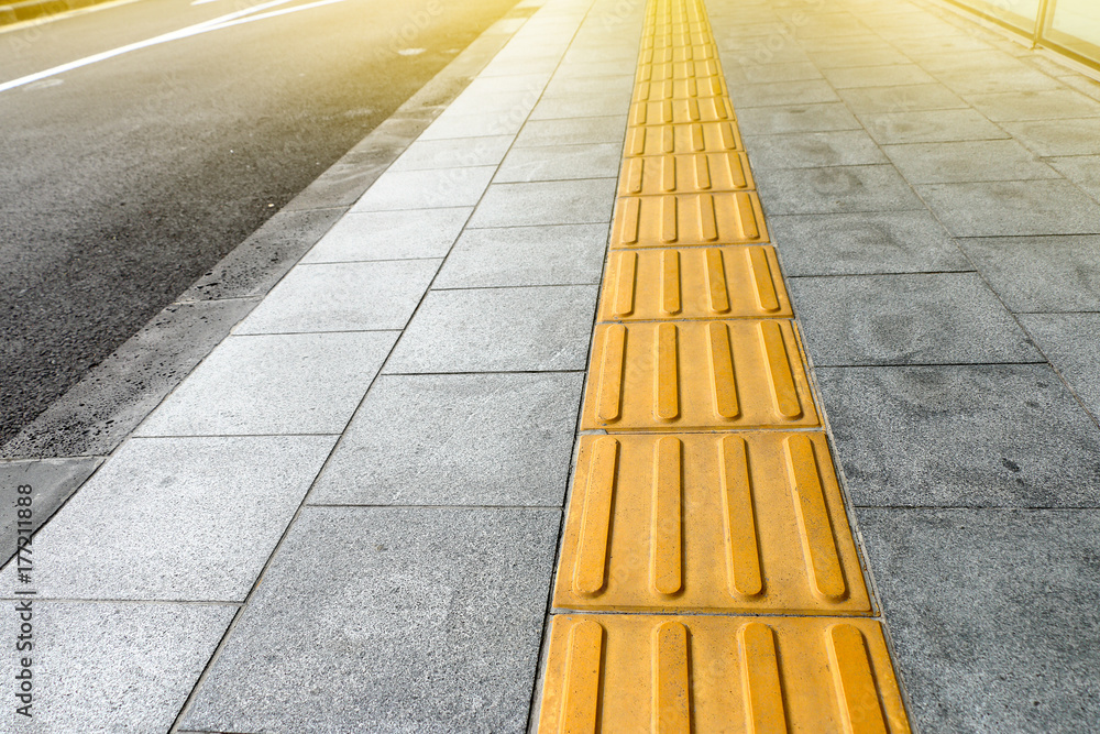 tactile paving for blind handicap on tiles pathway, walkway for ...