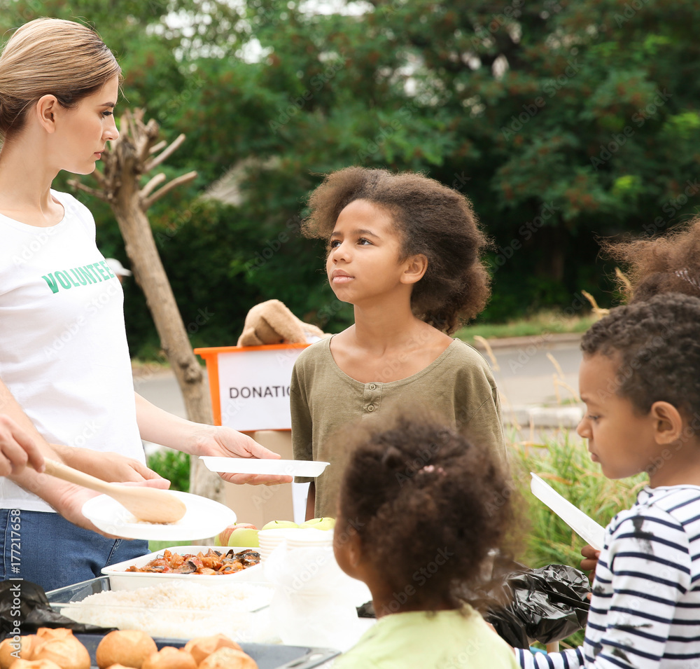 Children Sharing Food To The Poor