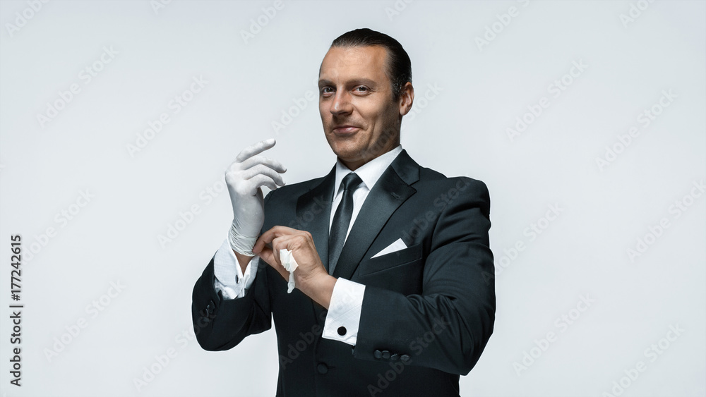 At Your service, well dressed man waiting for orders isolated on white ...