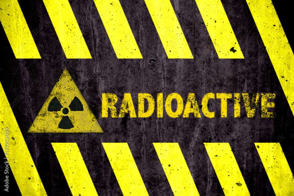Radioactive (ionizing radiation) danger symbol and word with yellow and ...