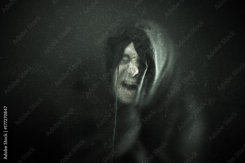 Angry ghost figure in the dark Stock Photo | Adobe Stock