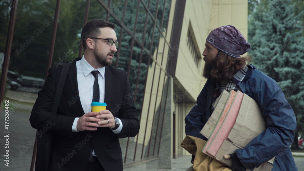 Rich man weared in suit with coffee walking on street and talking to ...