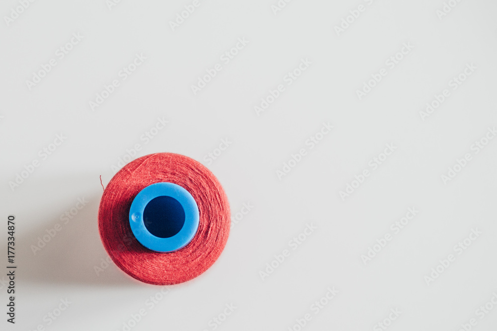 Spool of red thread Stock Photo | Adobe Stock