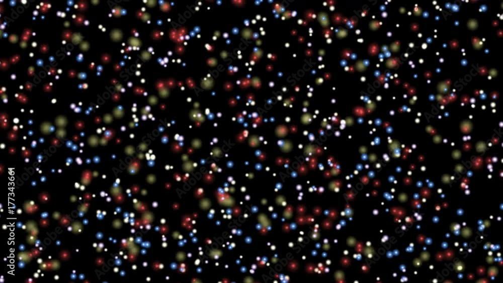 Multicolored light particles slow uneven moving on black background ...