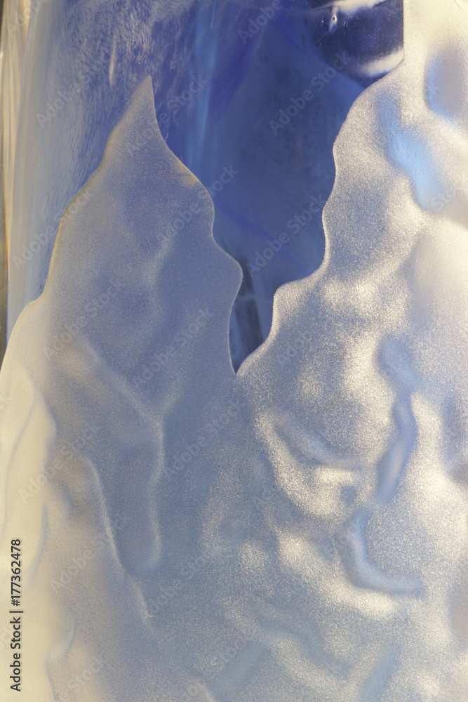 closeup macro blue textured flower vase internal patterns of glass flow ...