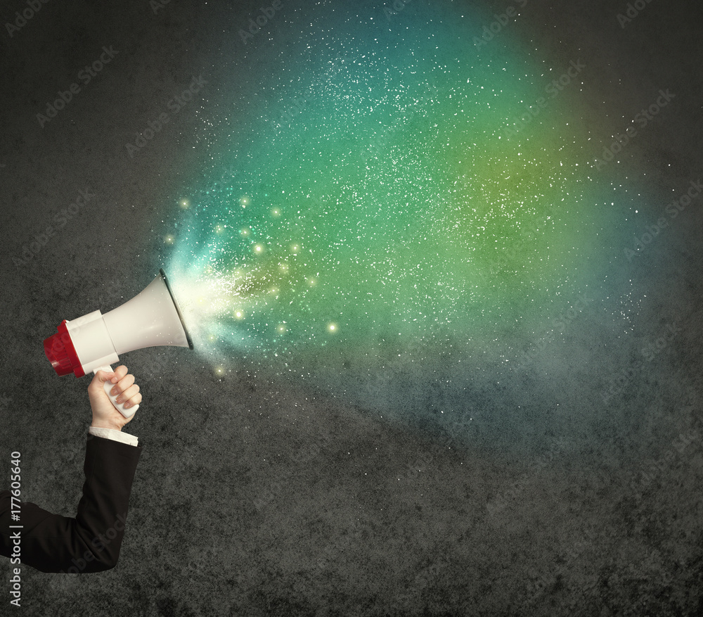 Hand holding megaphone Stock Photo | Adobe Stock