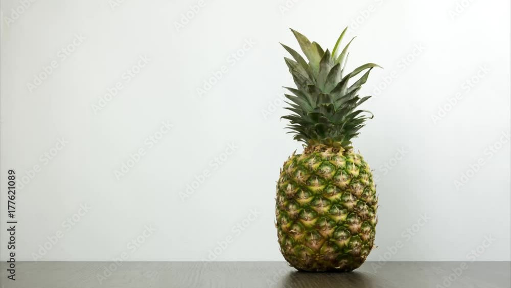 Pineapple appears in the frame, spinning and leaving the frame. One ...