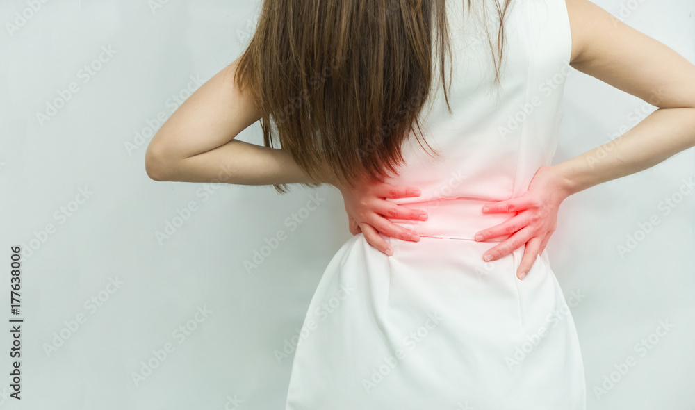 A woman in white dress feeling pain on his back. Office syndrome. Back ...