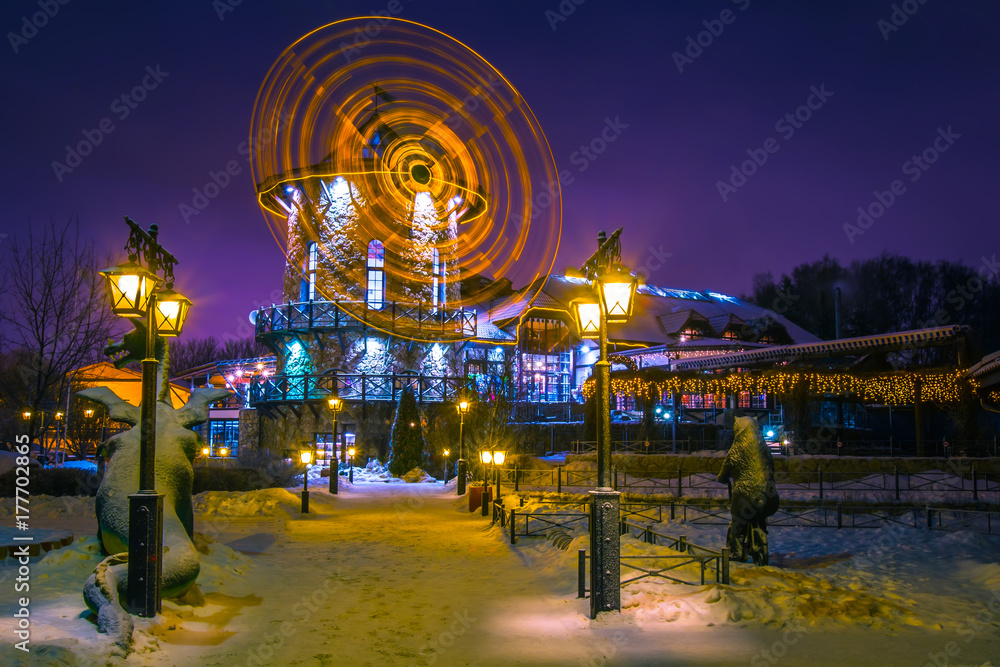 Rotation of the mill. Buildings of the mill with illumination. Stock ...