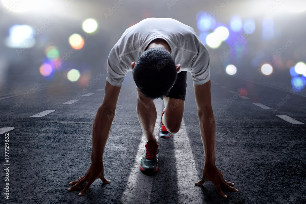 Man ready to run Stock Photo | Adobe Stock