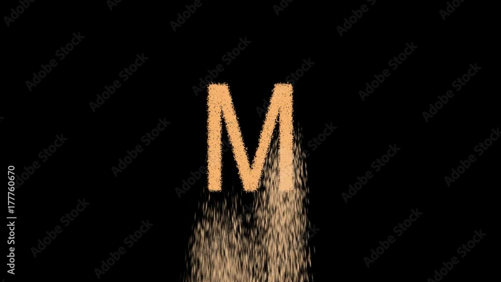 Letter M appears from sand, then crumbles. Transparent alpha channel ...