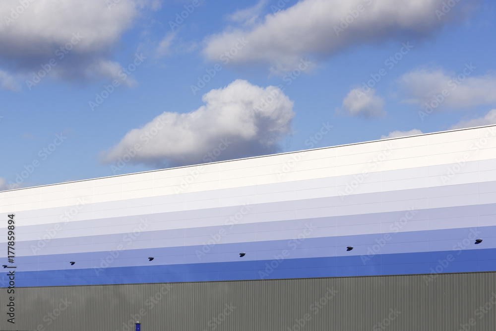 Industrial warehouse with different shades of blue panels on the ...