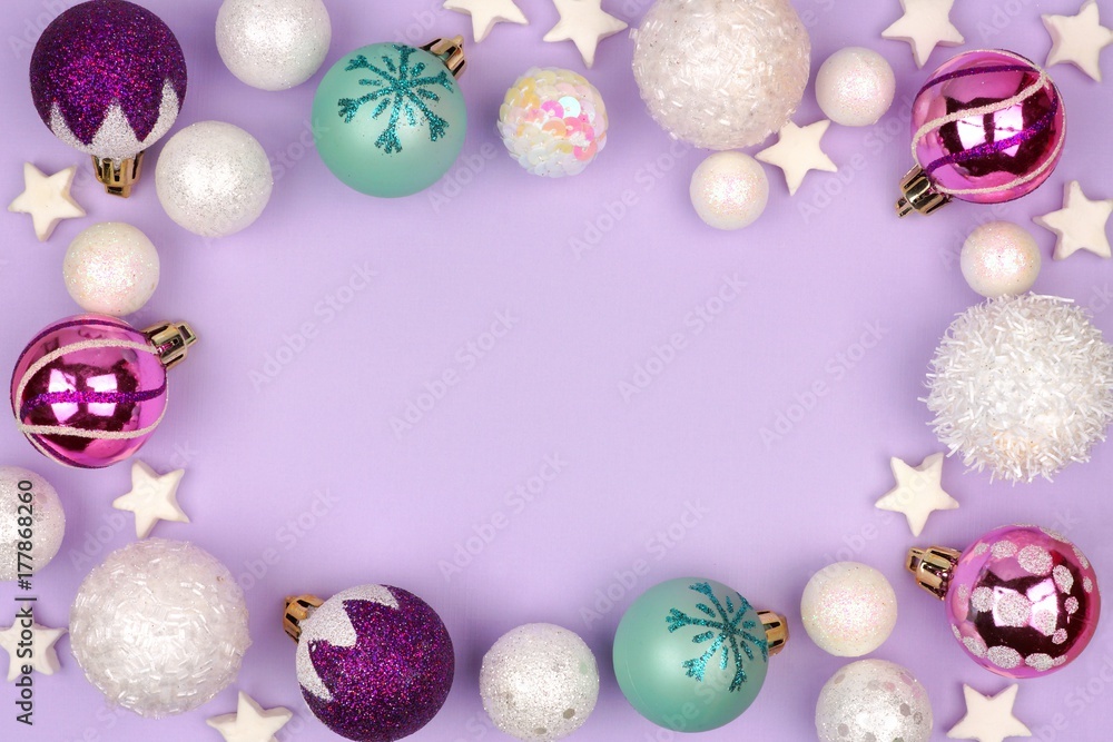Modern pastel Christmas bauble frame over a light purple background ...