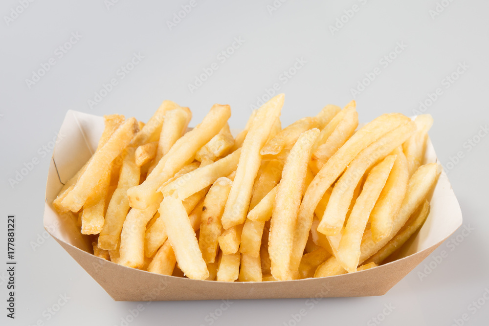 French fries in carton in kraft blank paper fry box on white background ...