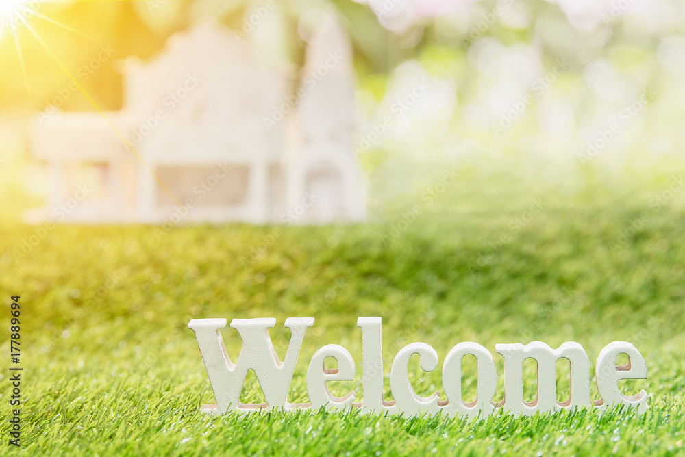 Welcome home on green grass background,paper family concept. Stock ...