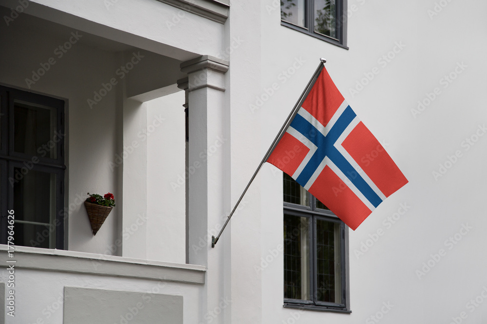 Norway flag. Norwegian flag hanging from a pole on a front door of a ...