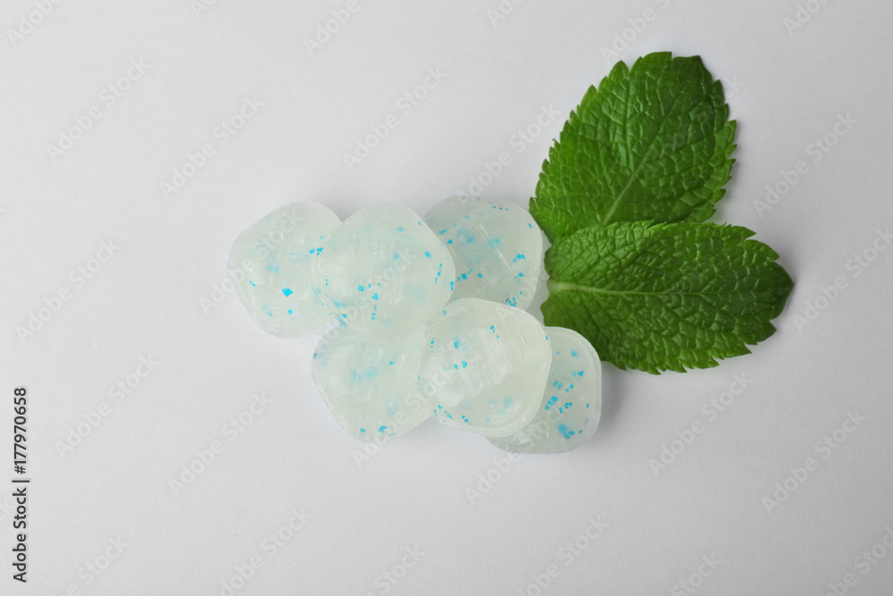 Delicious hard mint candies on light background Stock Photo | Adobe Stock
