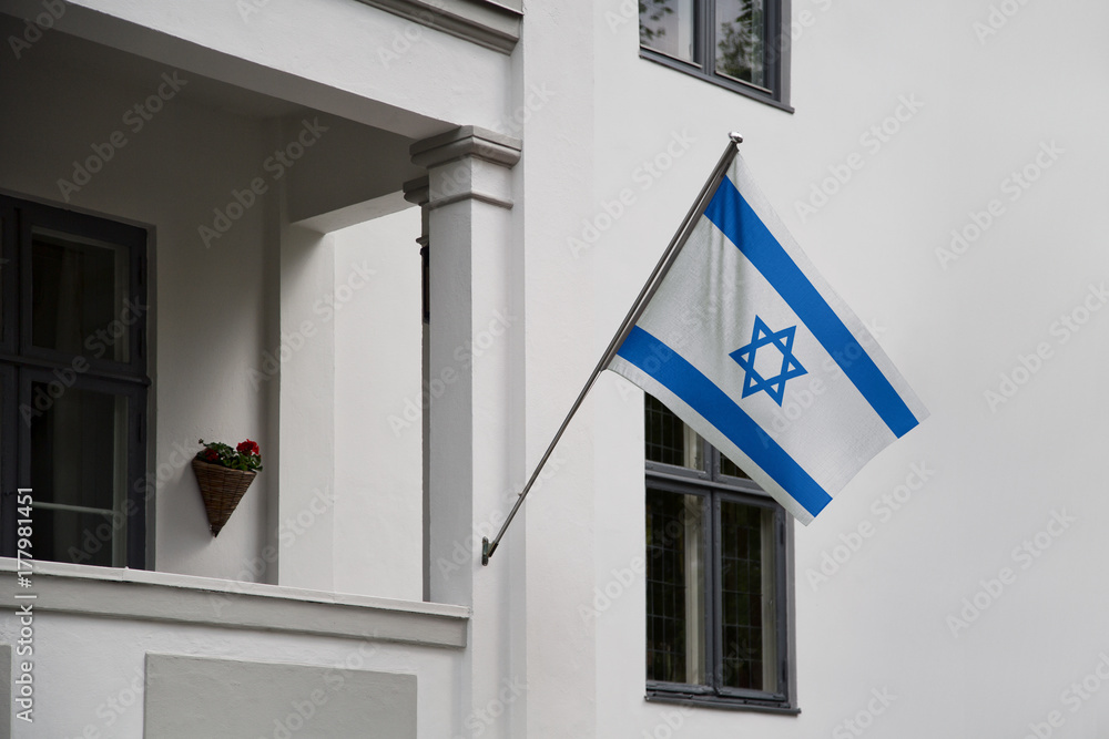 Israel flag. Israeli flag displaying on a pole in front of the house ...