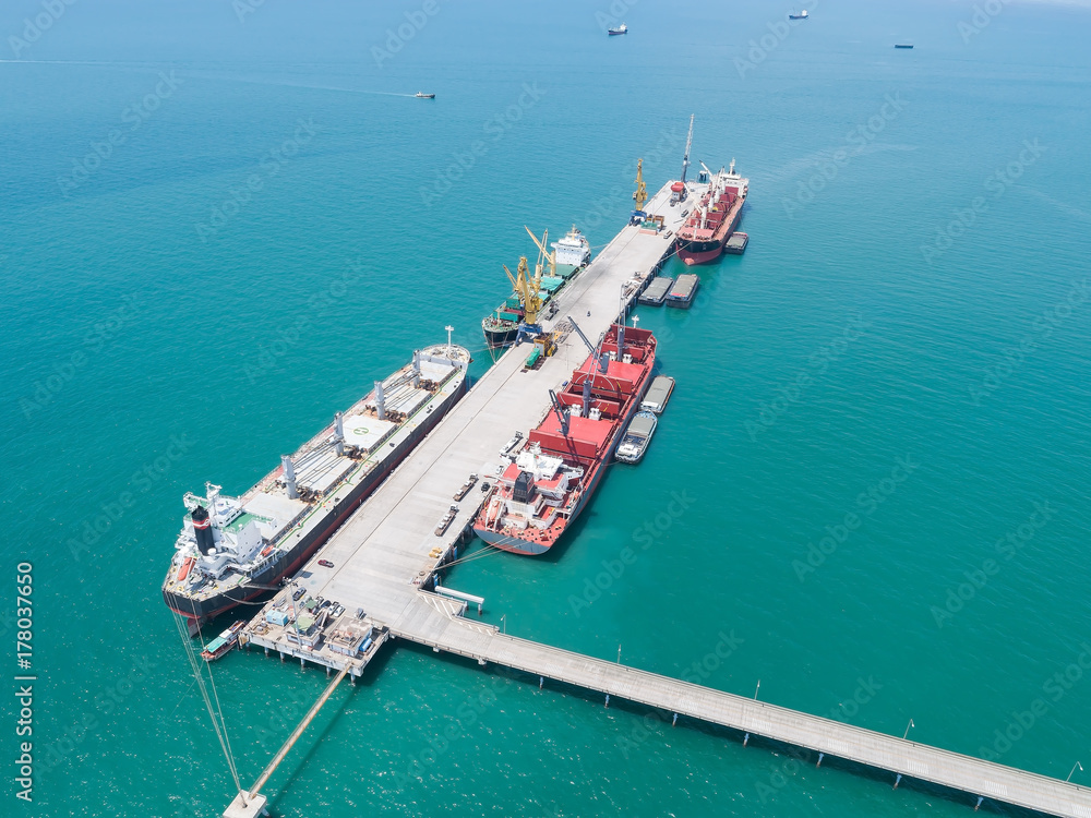 container ship commercial vessel alongside in port for loading and ...