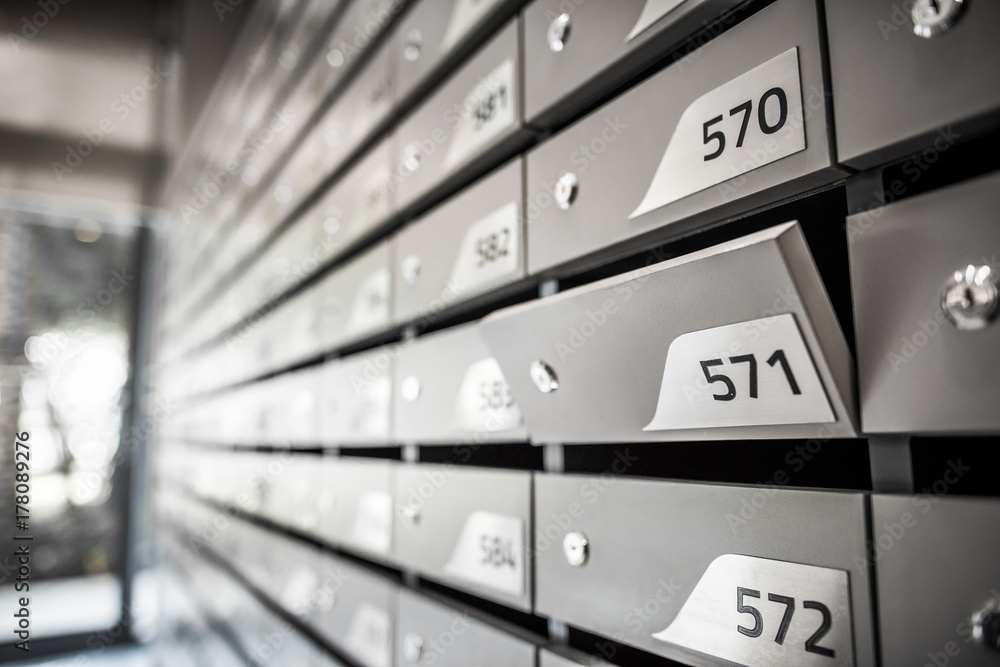 Mail boxes filled of leaflets and letters. Shallow DOF,Mailboxes and ...
