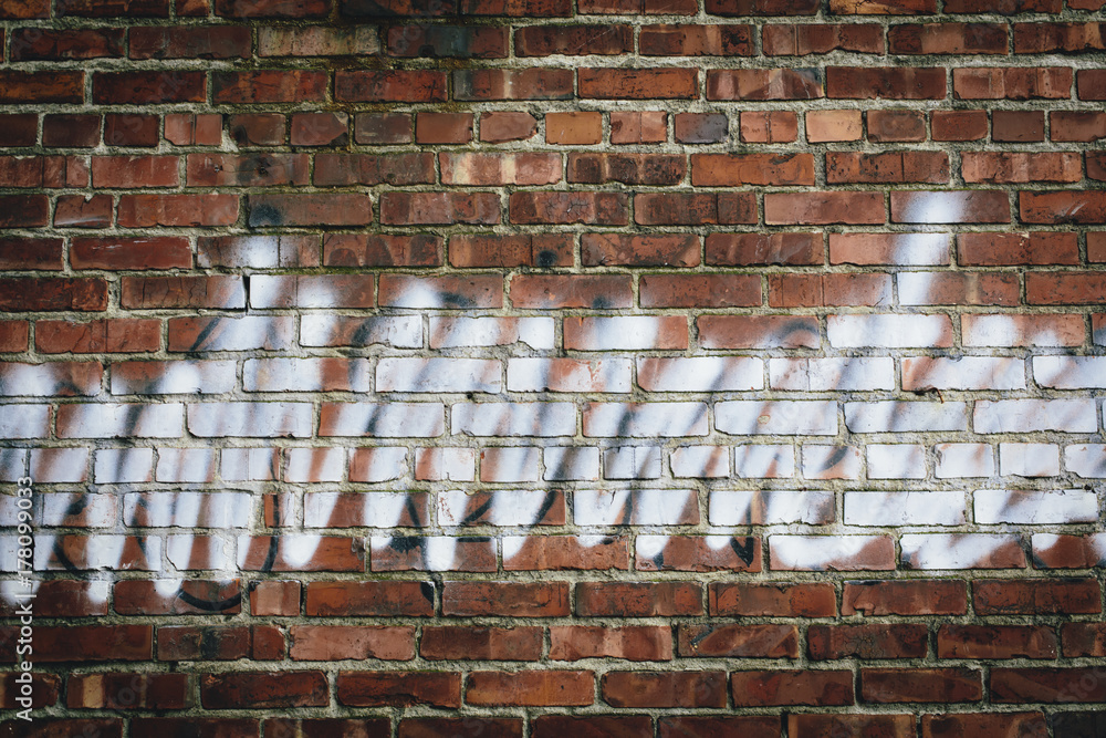 Graffiti on brick building wall Stock Photo | Adobe Stock